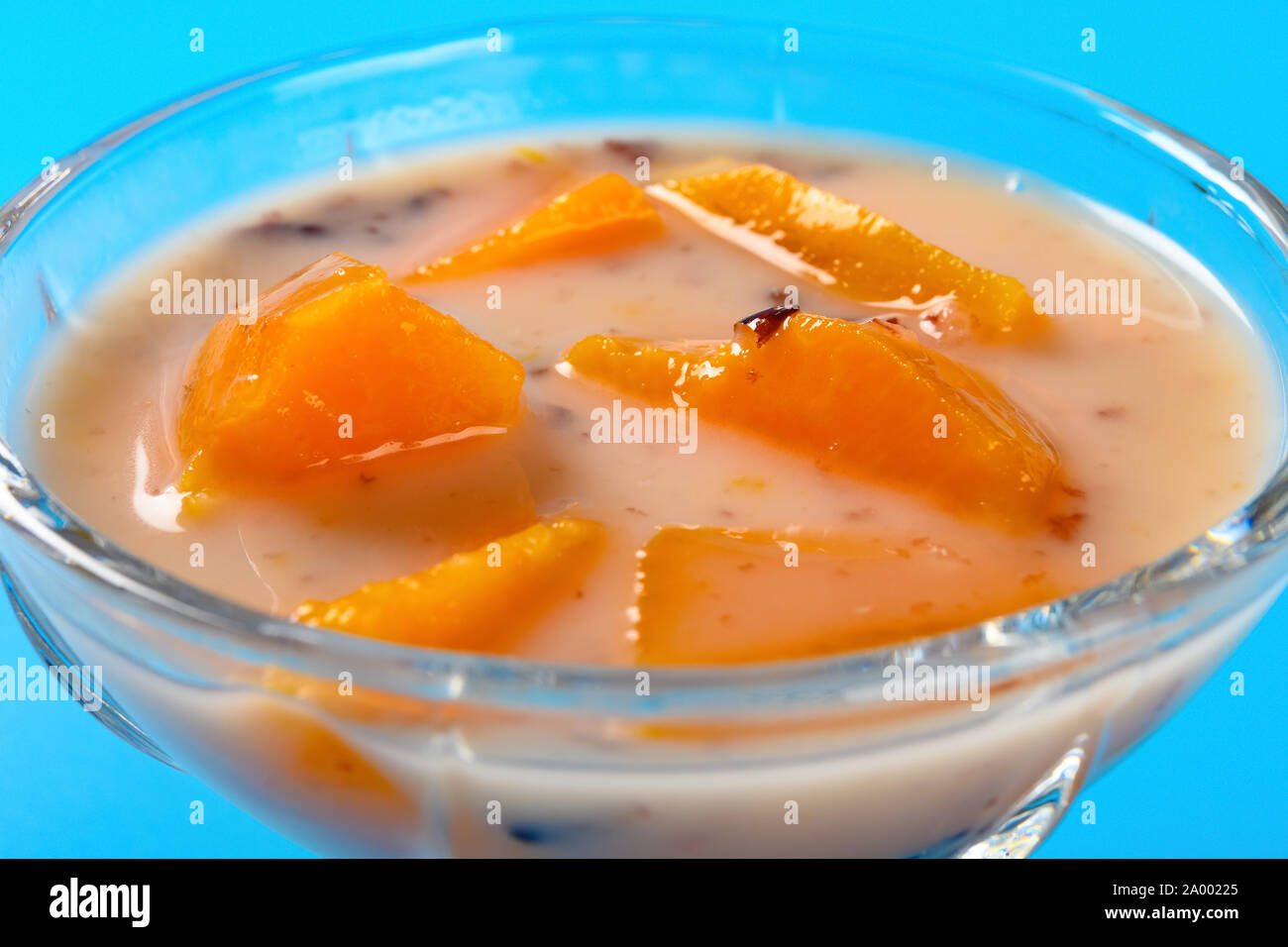 glass cup of Chinese syrup of sweet potato and purple rice close up ...