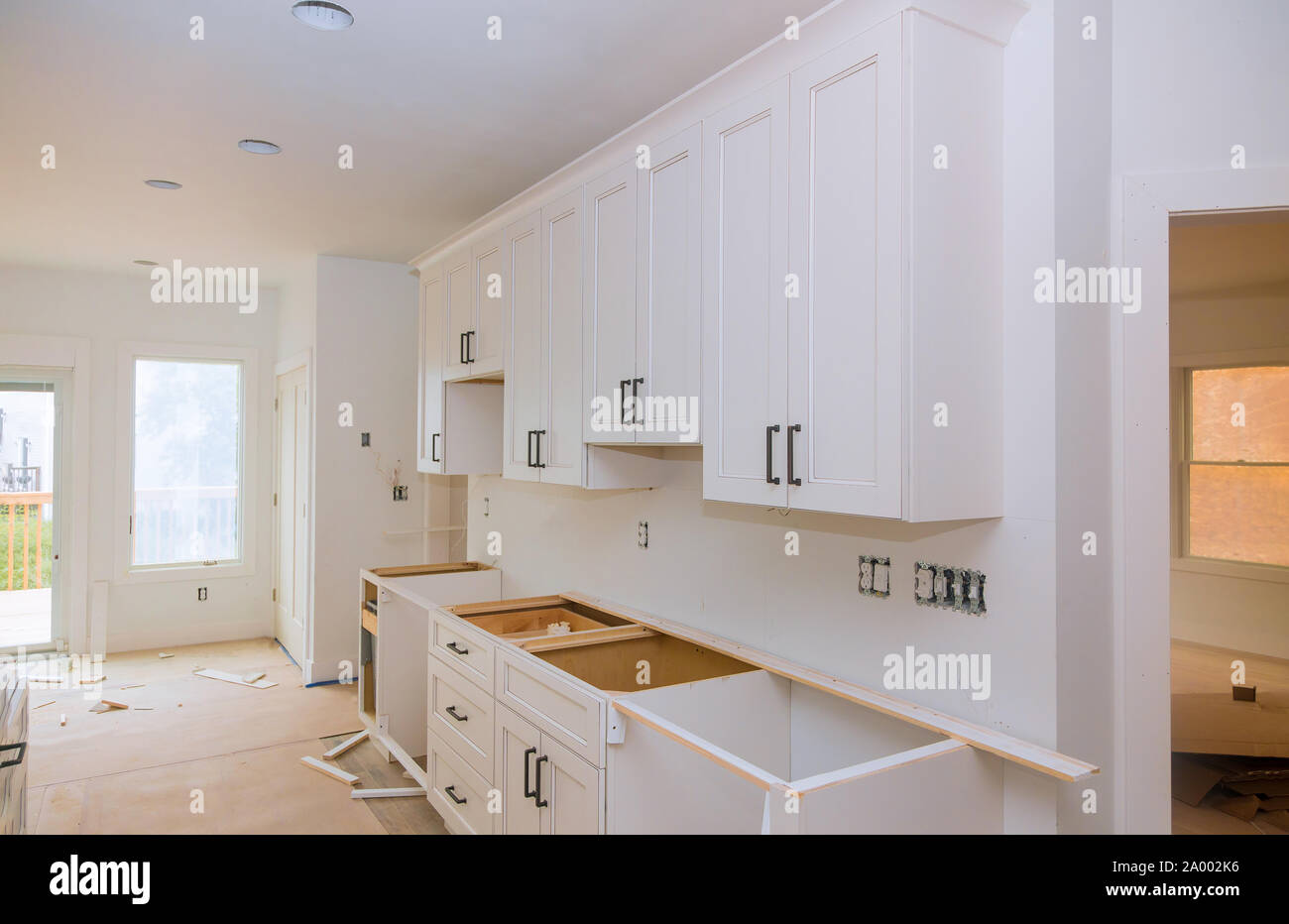 Custom kitchen cabinets in various stages of installation base for ...