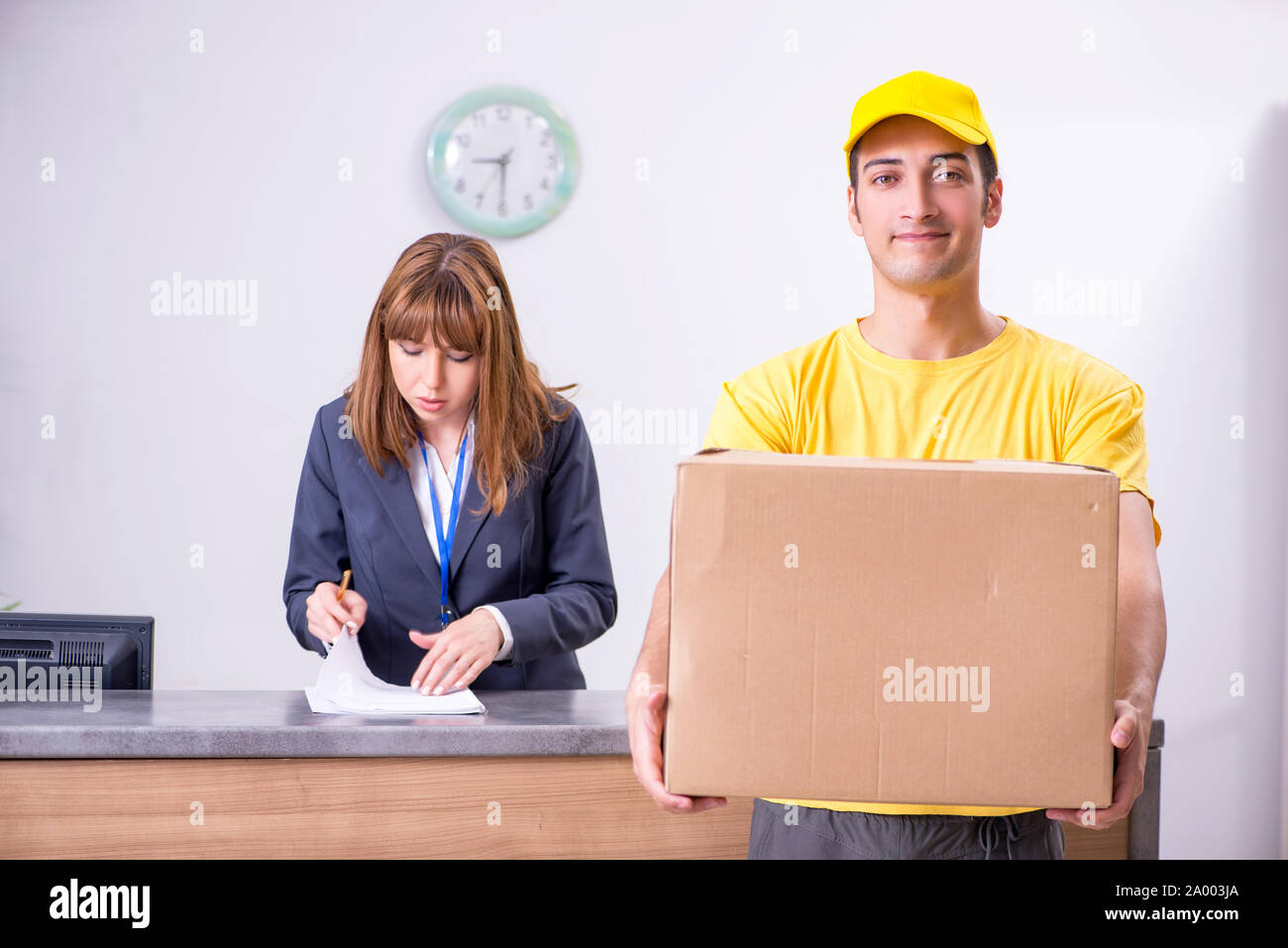 Male receptionist receiving payment hi-res stock photography and images ...