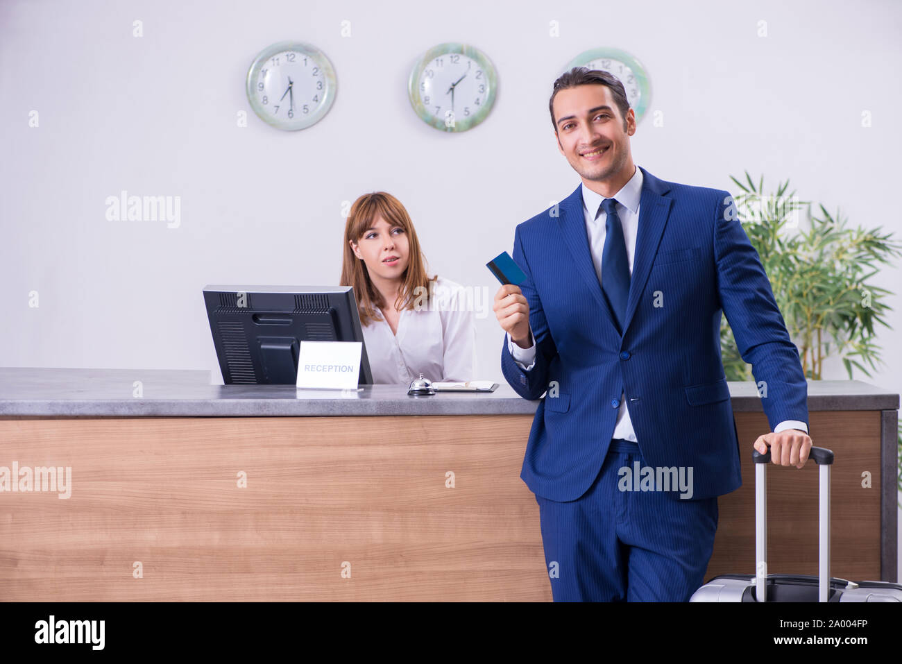 The young businessman at hotel reception Stock Photo - Alamy