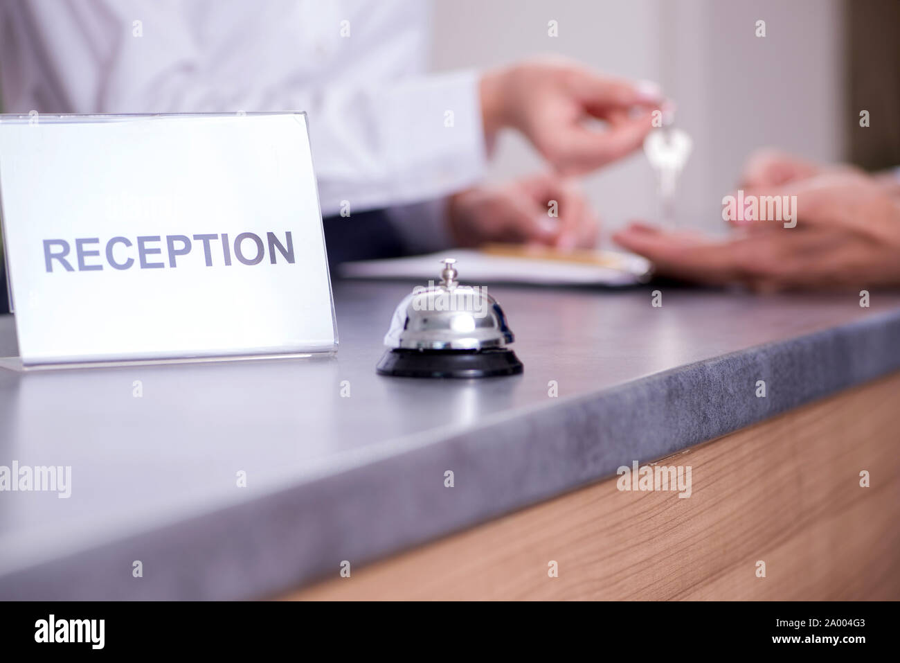 The hotel reception bell at the counter Stock Photo - Alamy