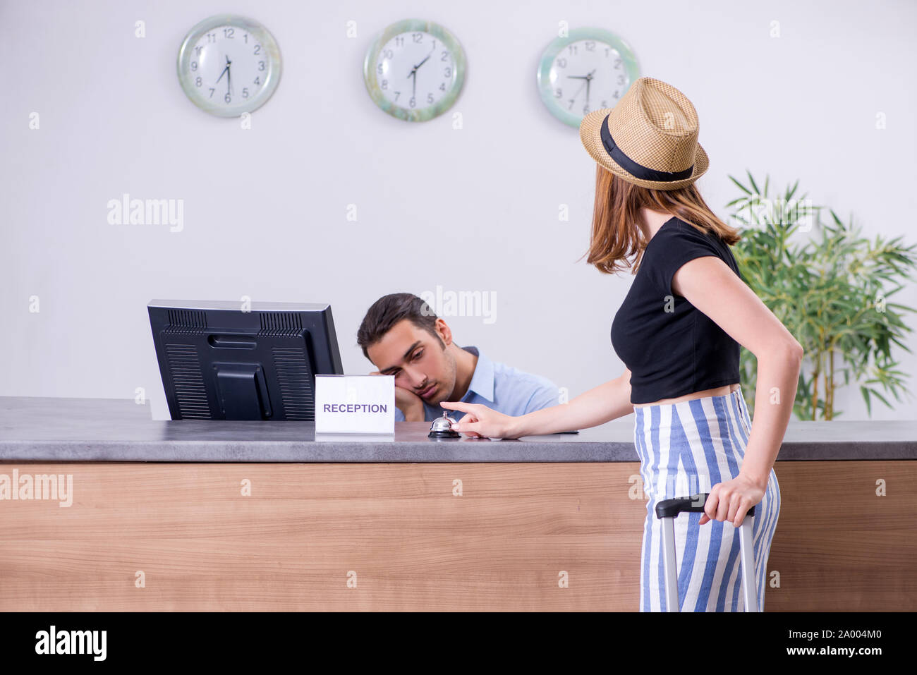 The young woman at hotel reception Stock Photo - Alamy