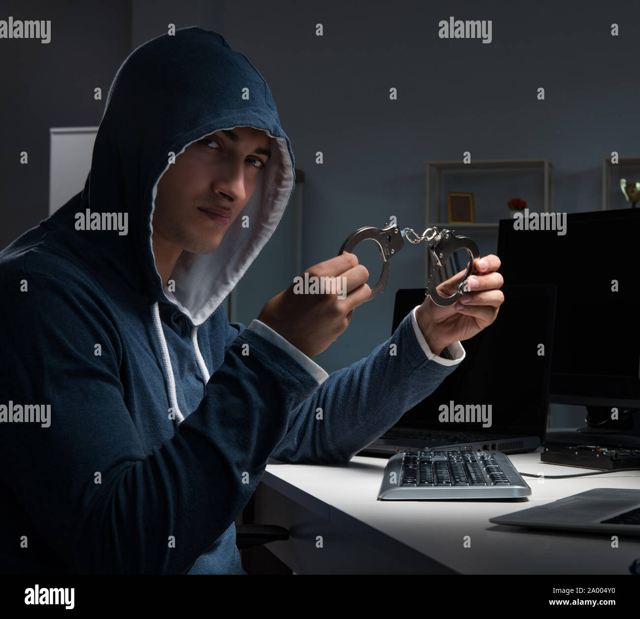 The hacker hacking computer at night Stock Photo - Alamy