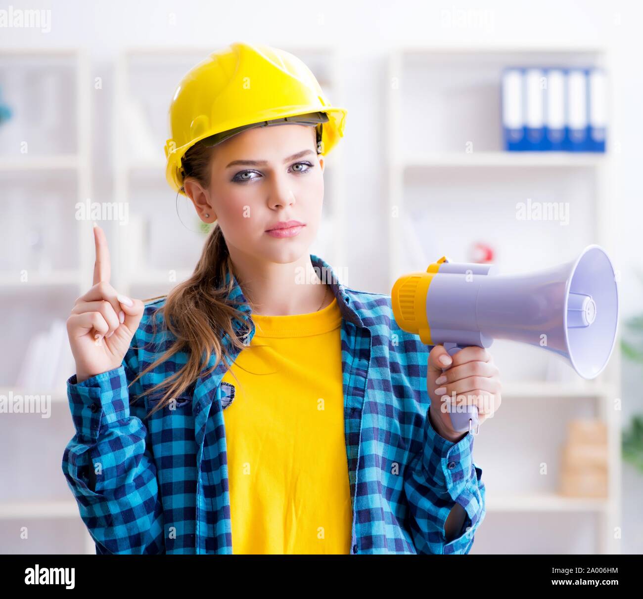 The angry building supervisor with megaphone Stock Photo - Alamy
