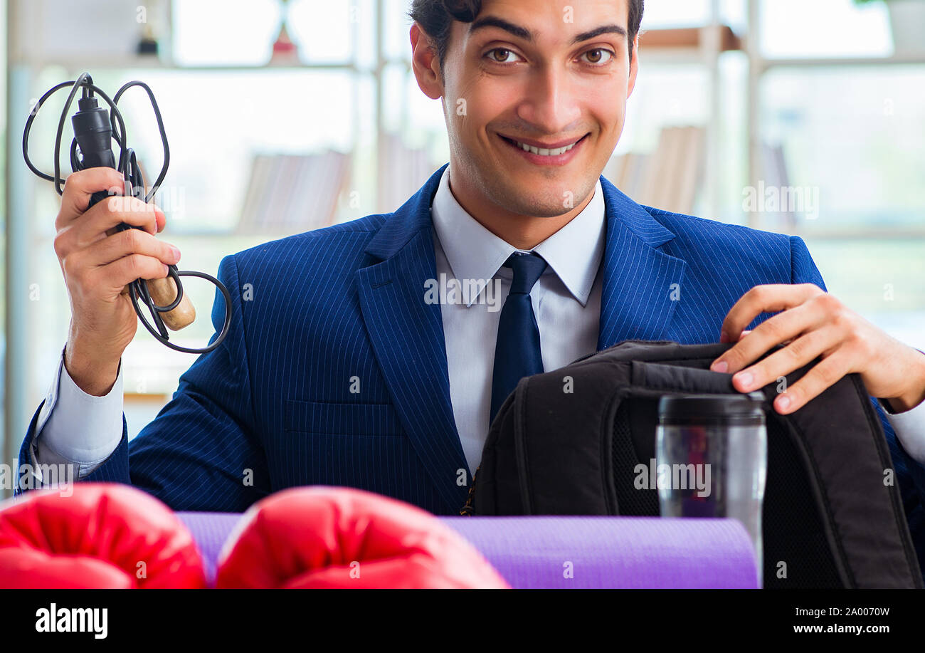The man with boxing gloves in the office Stock Photo - Alamy