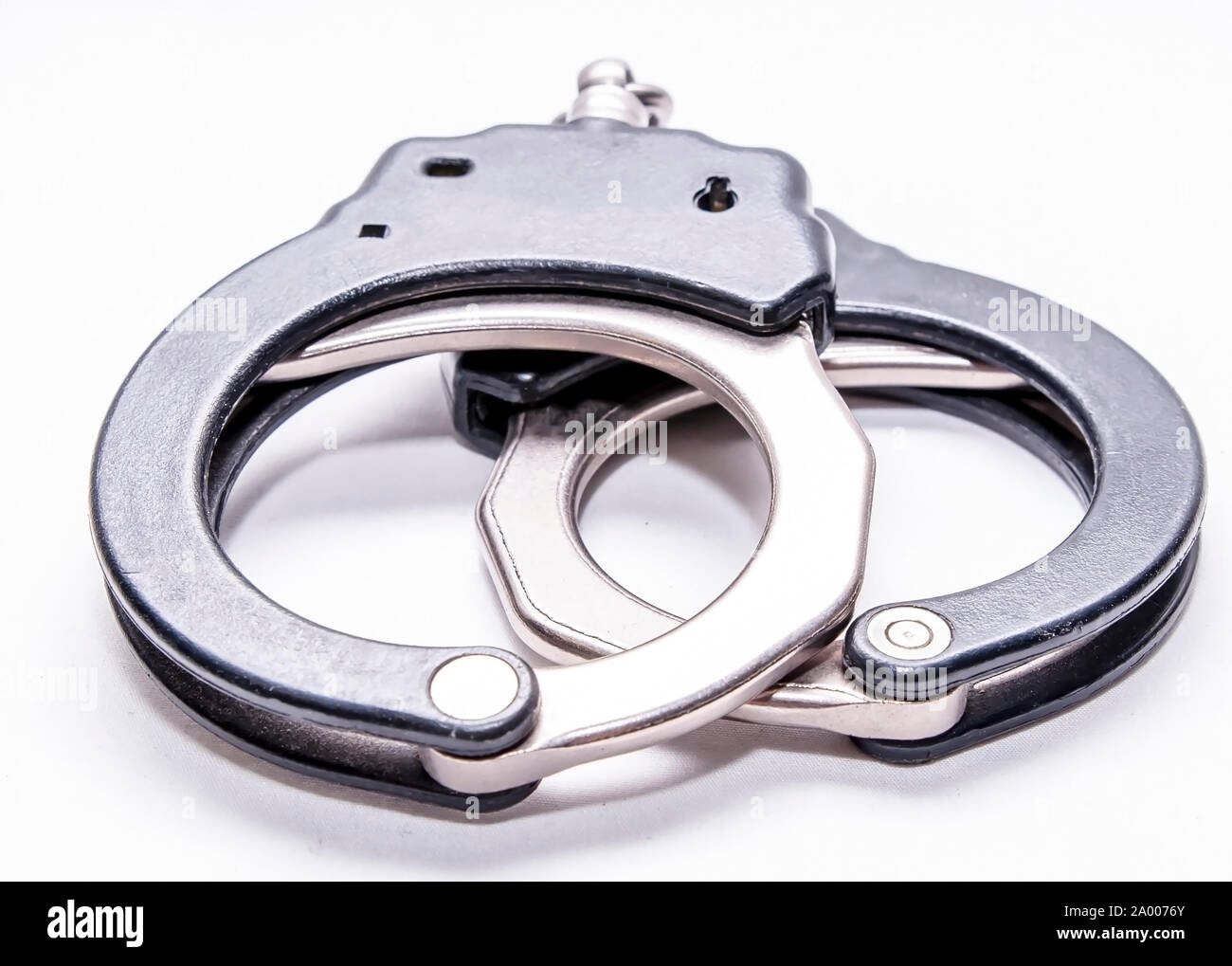 Handcuff Cut Out Stock Images & Pictures - Alamy