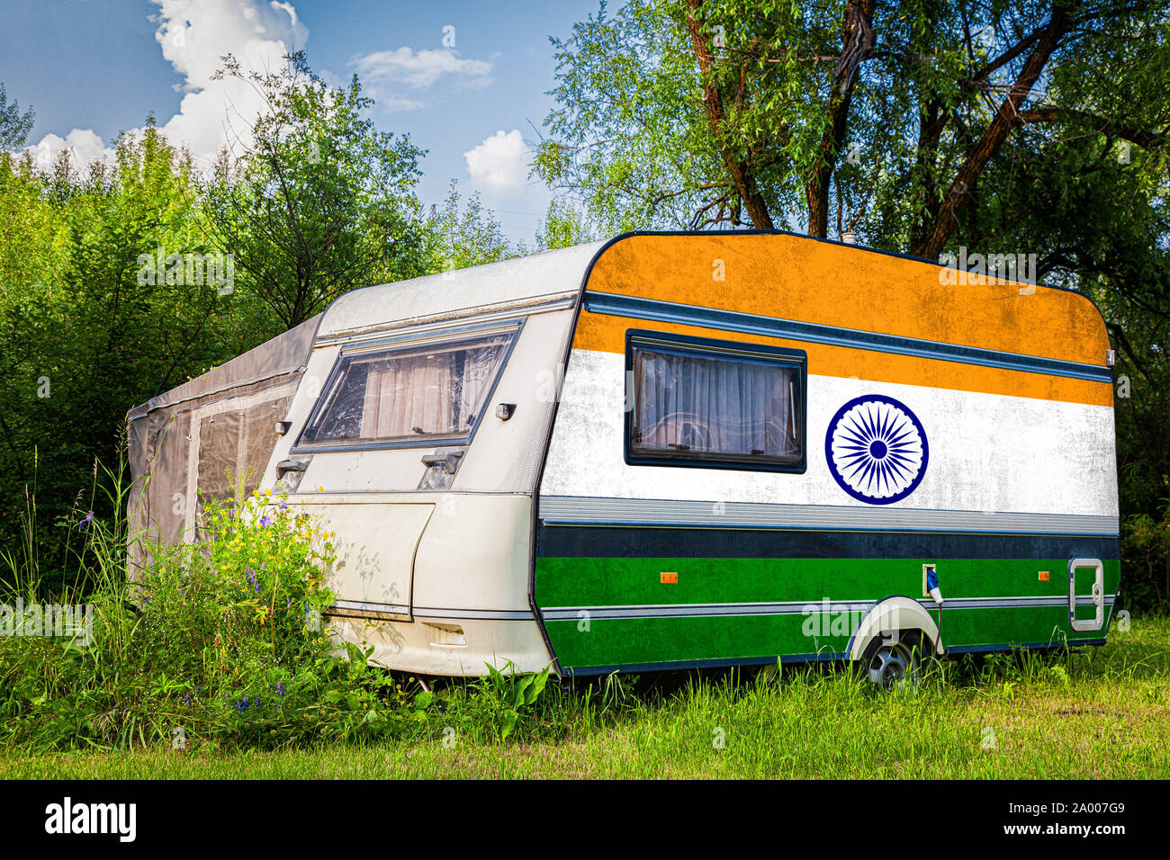 A car trailer, a motor home, painted in the national flag of India ...