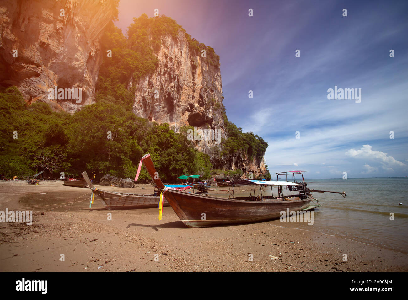 Thai traditional wooden longtail boat and beautiful sand beach at ...