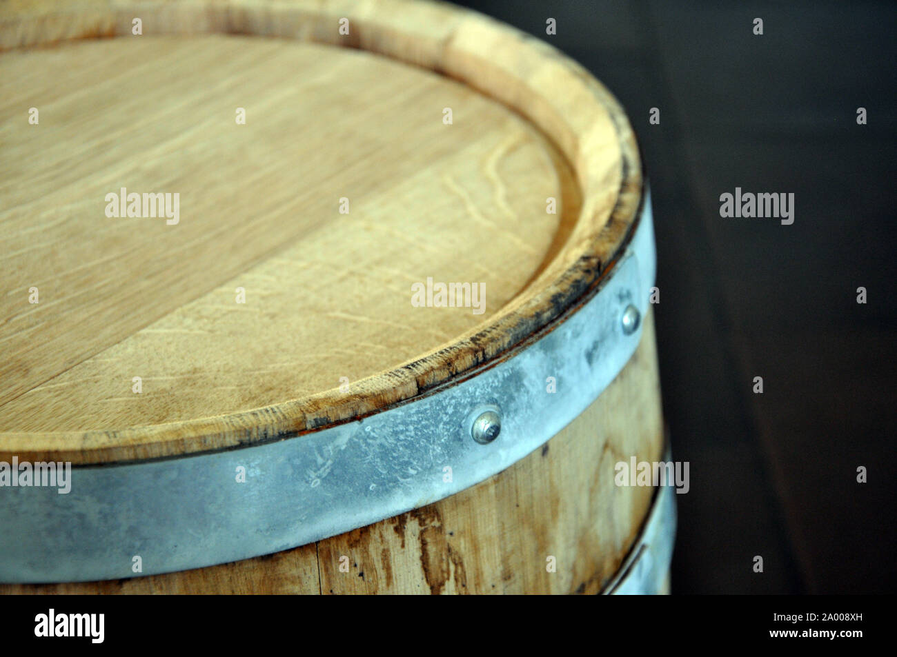 New oak barrel with young wine, cap and rivets. Winemaking and home ...