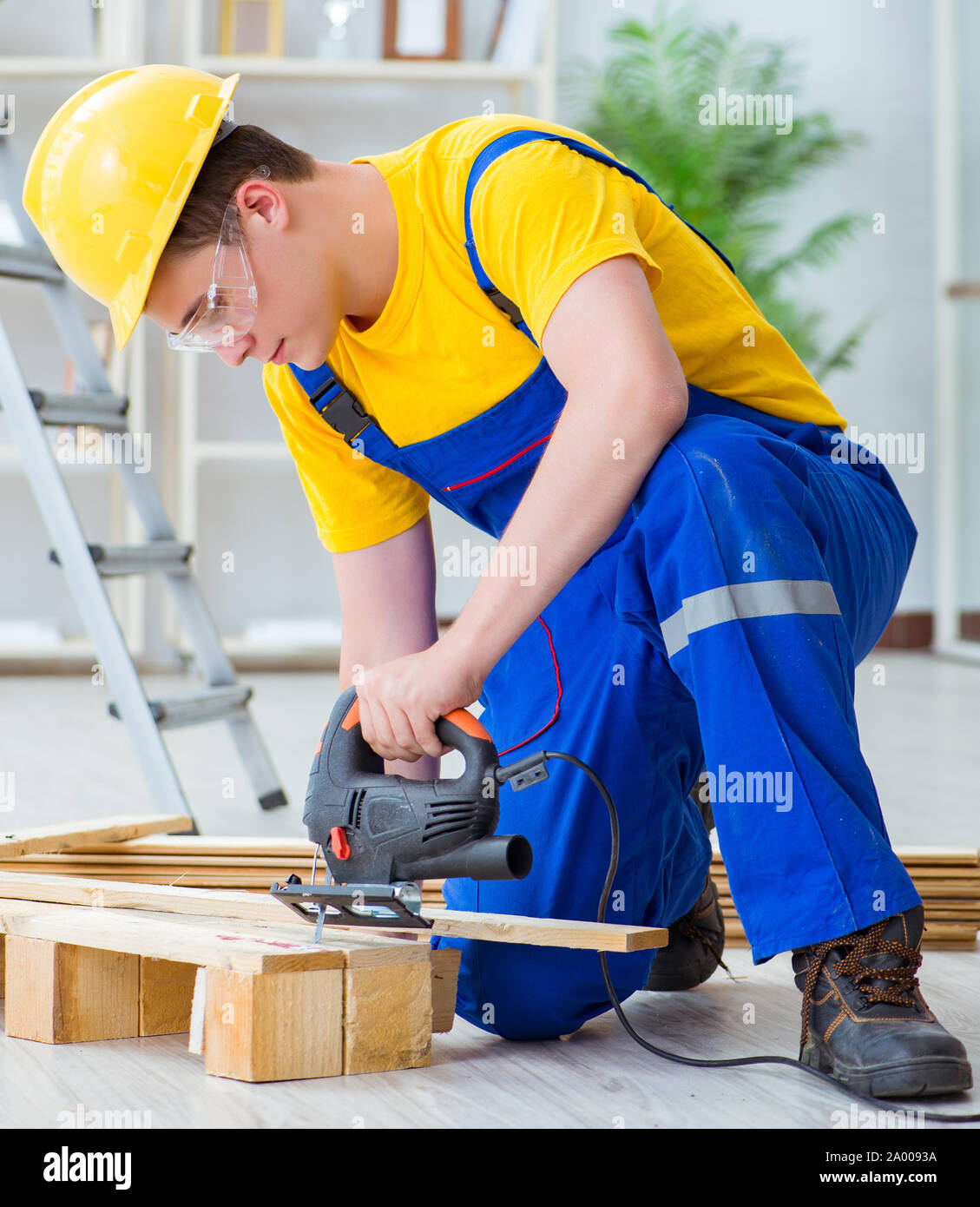 The young man assembling wood pallet Stock Photo - Alamy