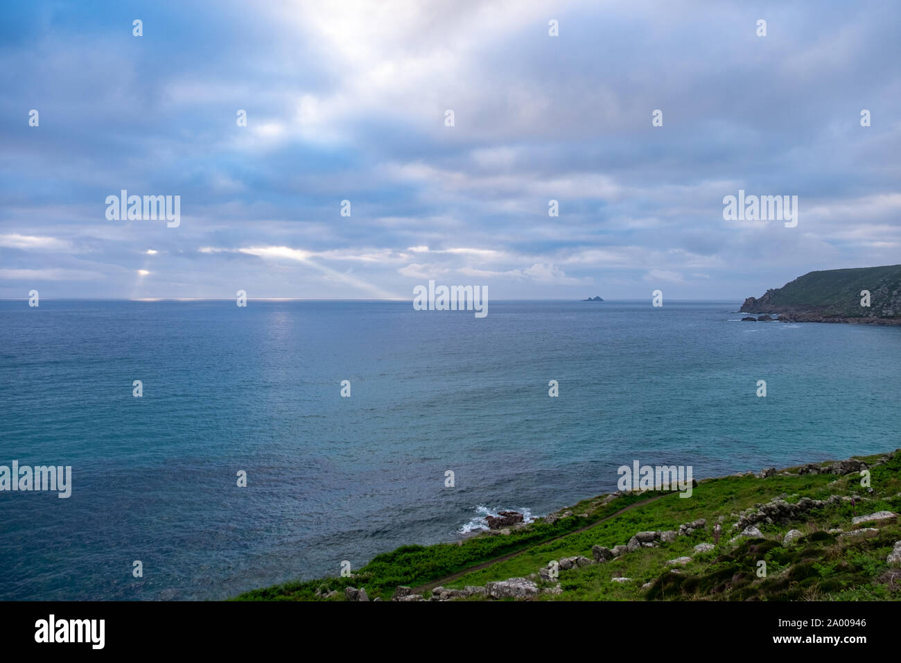 Cornish shore overlooking sun rays Stock Photo - Alamy