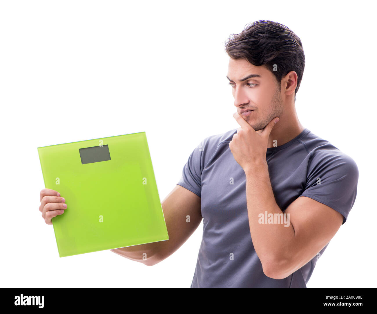The man with scales in sports and health concept isolated on white ...