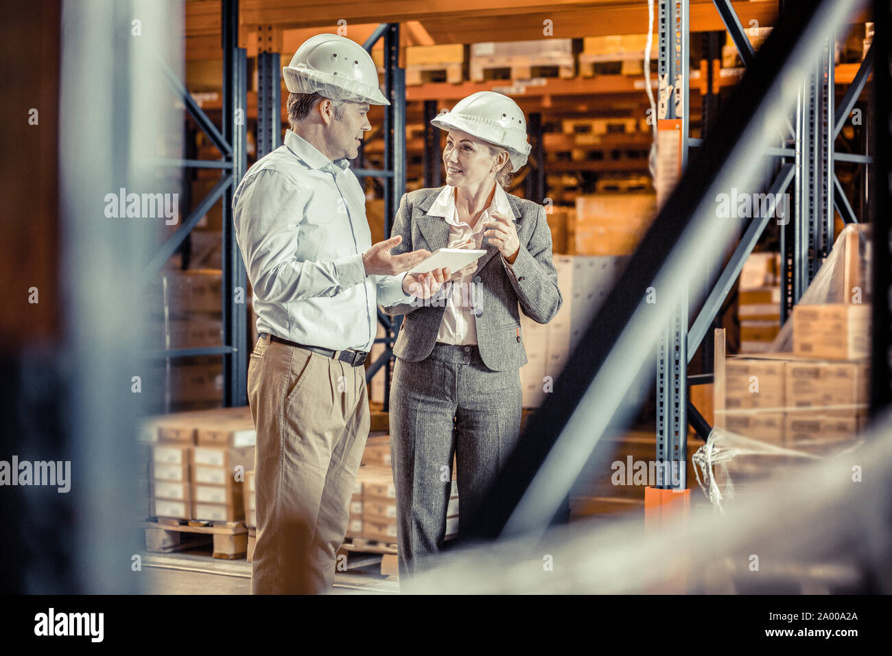 Amazing young female talking to her director Stock Photo - Alamy