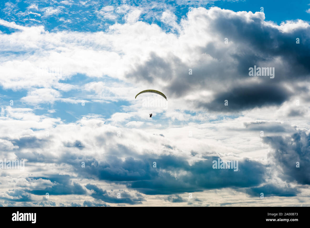 Paragliding flying through the air Stock Photo - Alamy