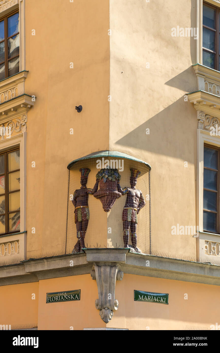 A stucco figure on the corner of the facade of the house : Warsaw ...