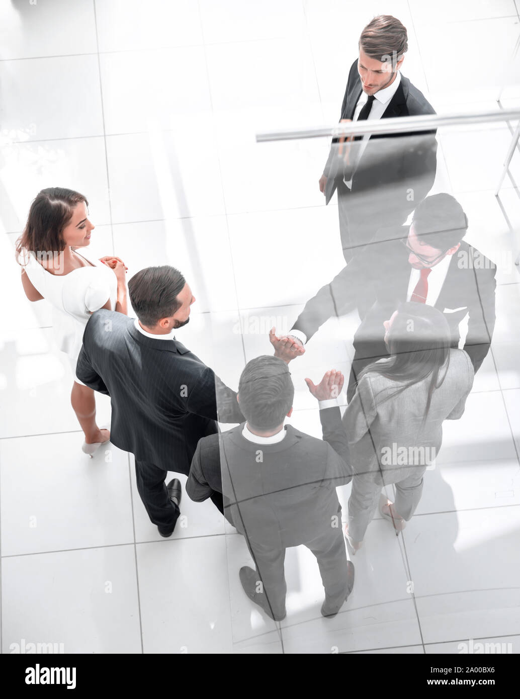 top view. business partners stretching out their hands for a handshake ...