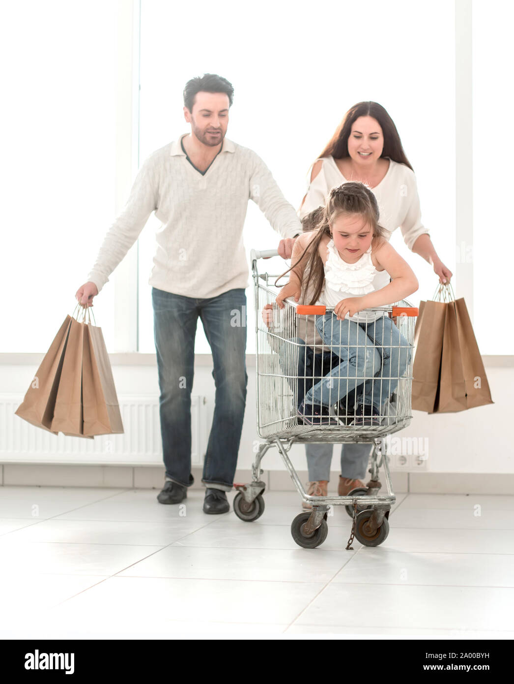 happy parents with children go shopping Stock Photo - Alamy