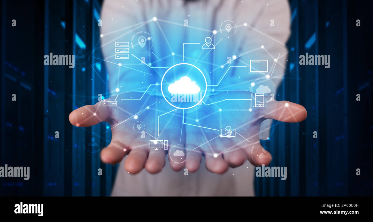 Man holding hologram projection displaying cloud technology symbols ...