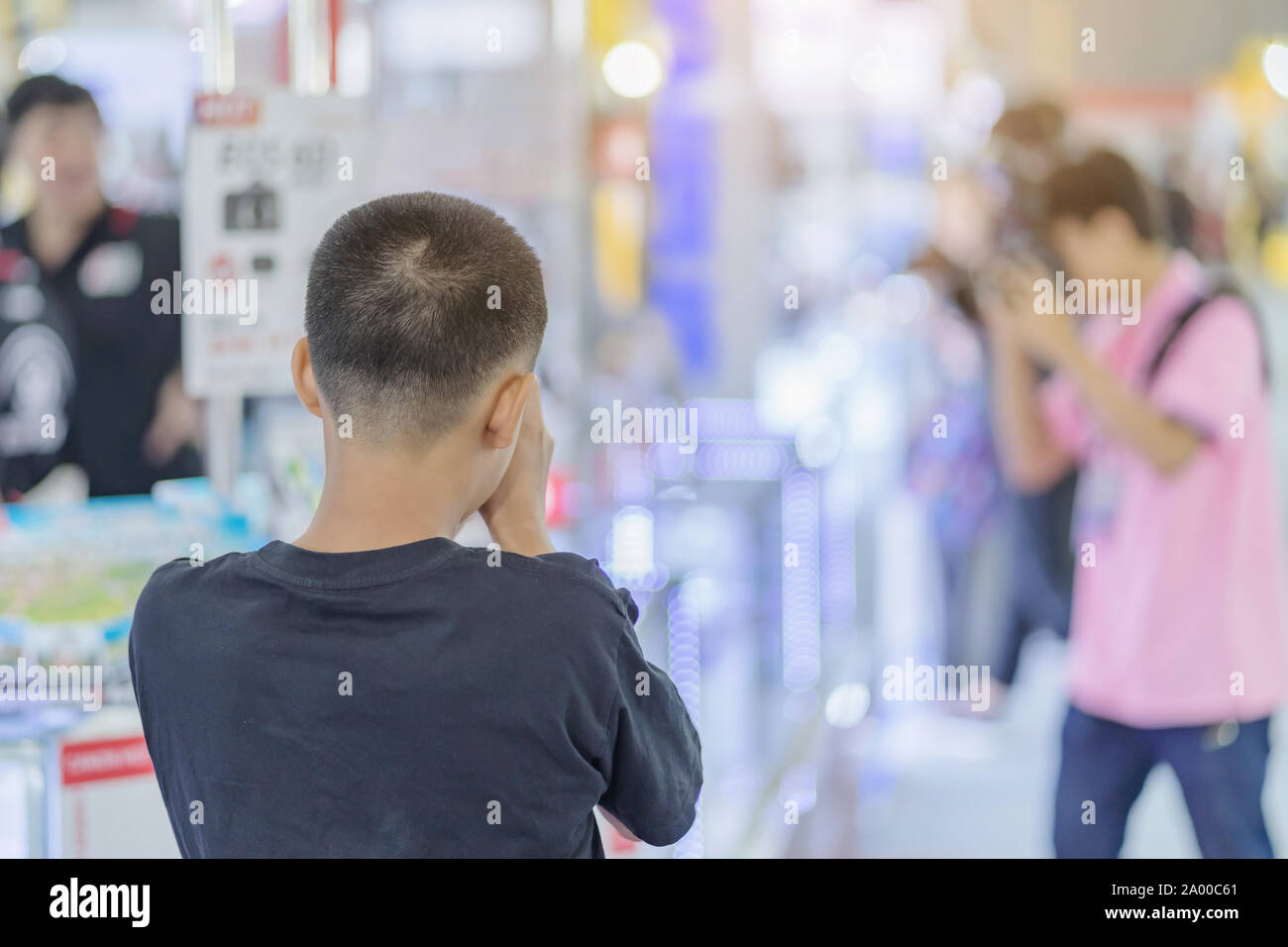 People testing professional photography cameras at Trade show on ...