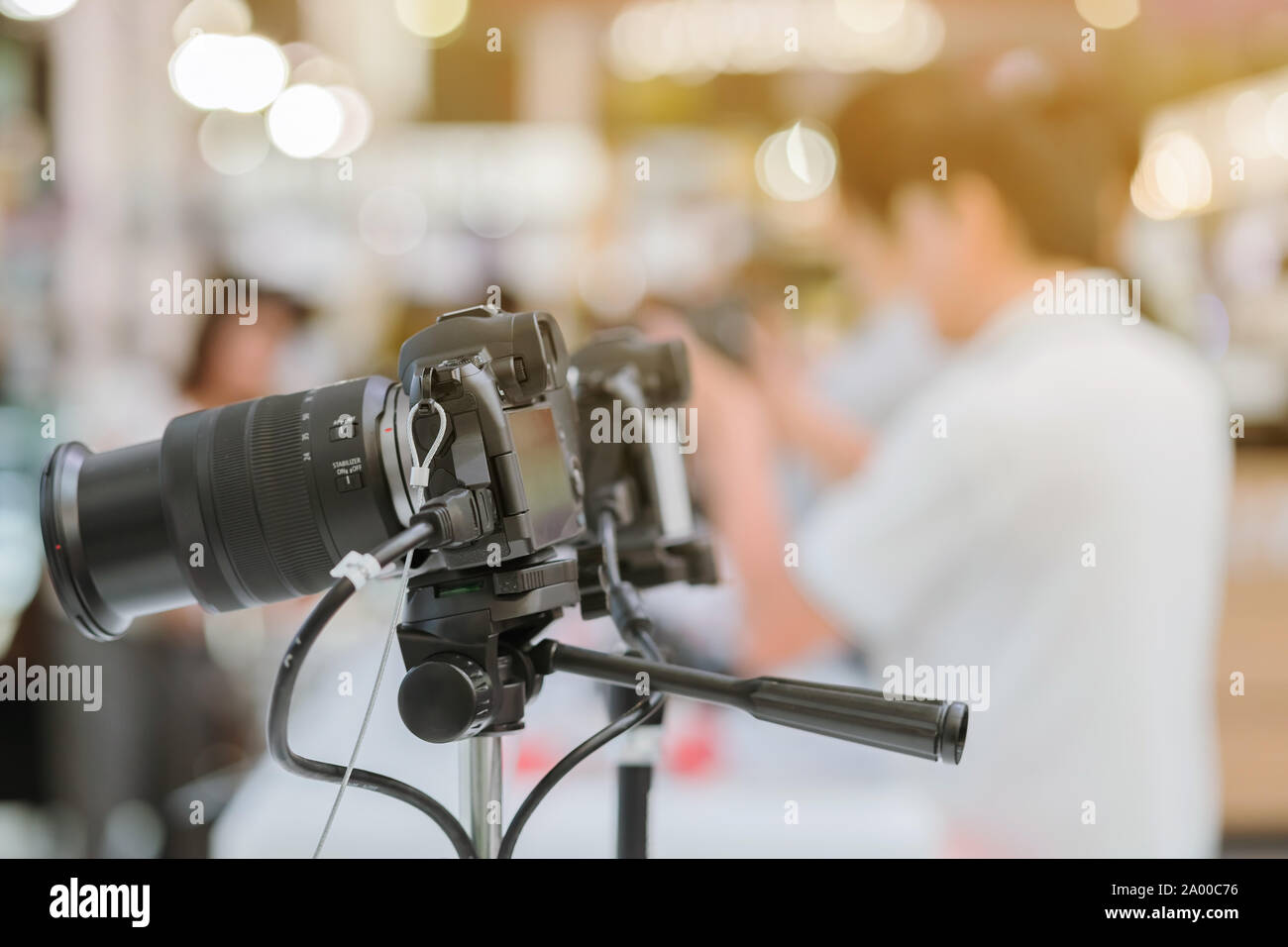People testing professional photography cameras at Trade show on ...