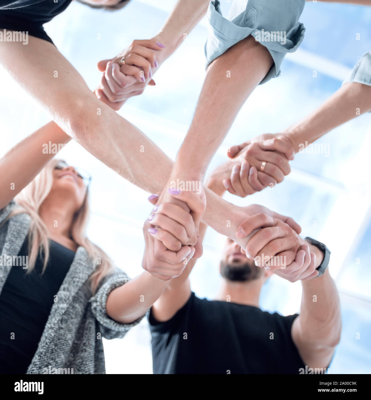 United hands on white background Stock Photo - Alamy
