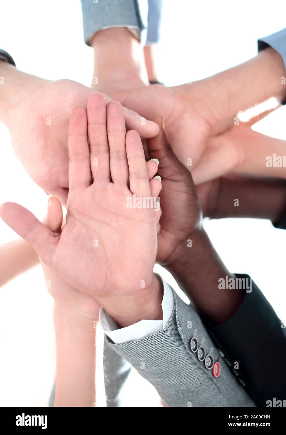 Low angle view of fit people stacking hands Stock Photo - Alamy