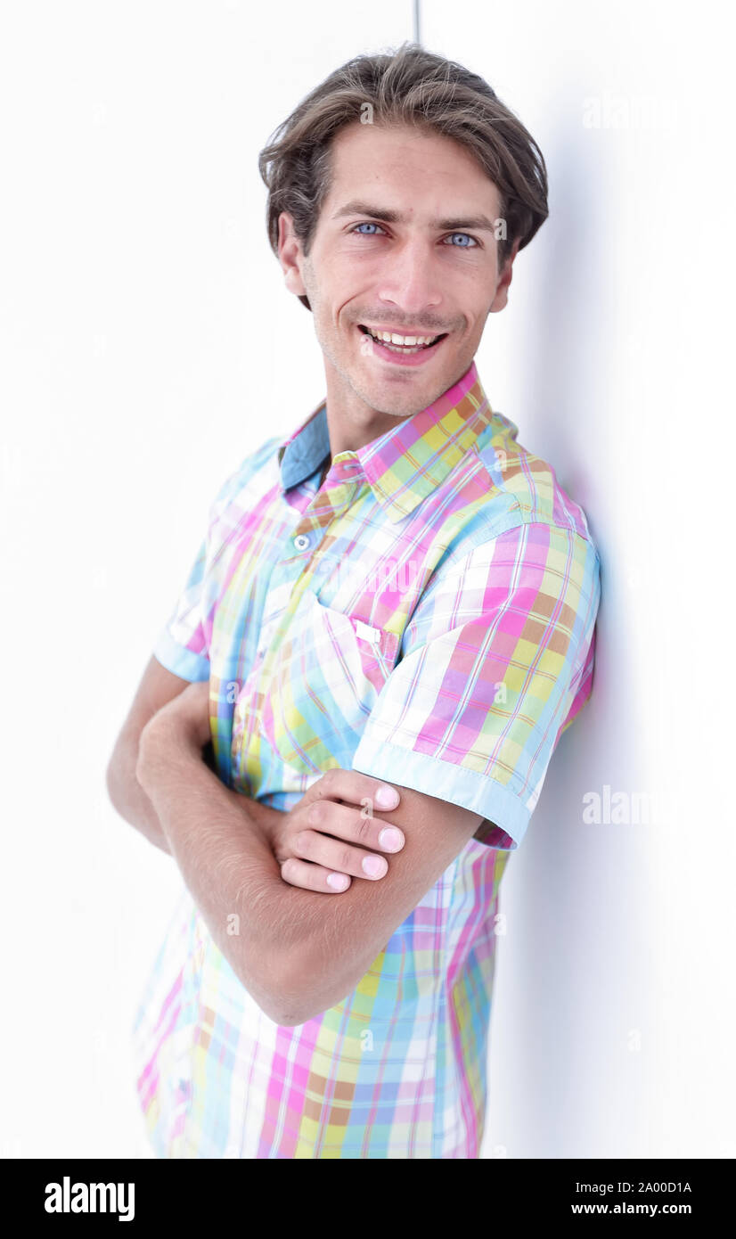 successful young man leaning on wall Stock Photo - Alamy