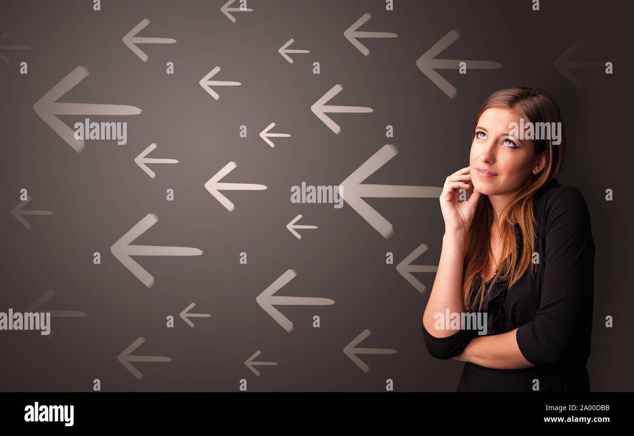 Young person thinking with direction concept background Stock Photo - Alamy