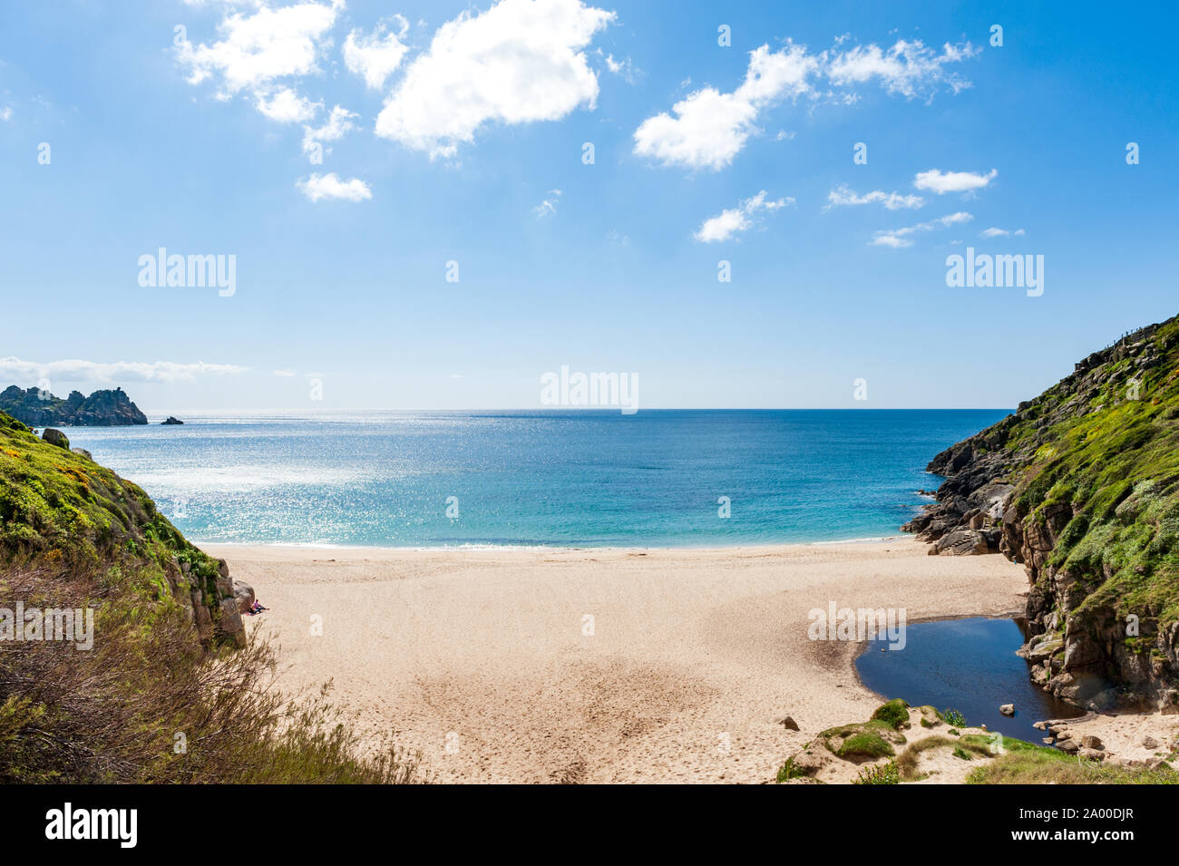 A beach nestled between two hills Stock Photo - Alamy