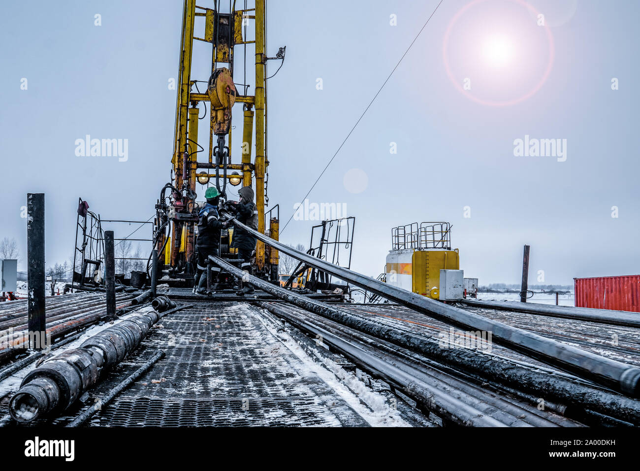 Workover rig working on a previously drilled well trying to restore ...