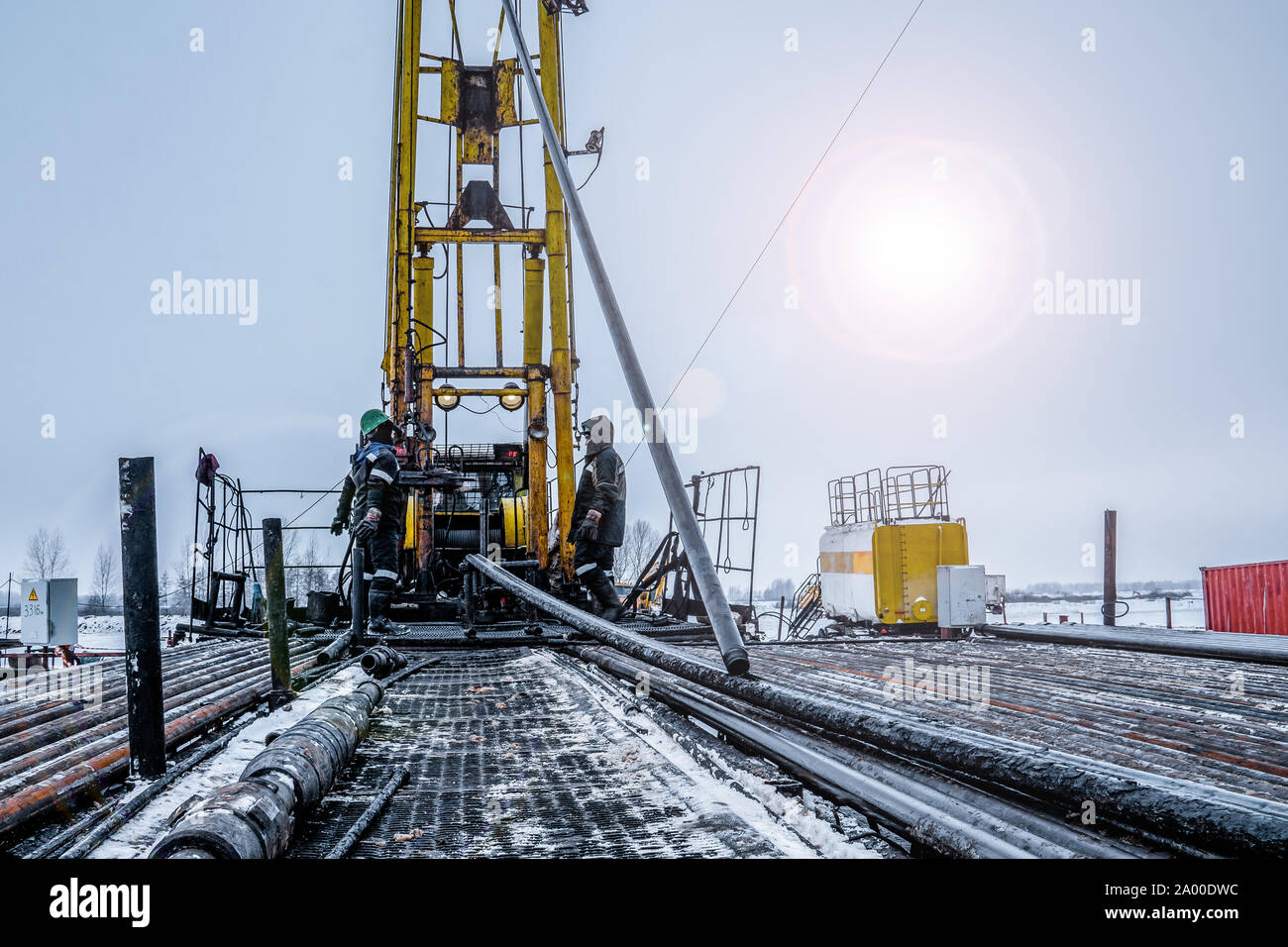 Workover rig working on a previously drilled well trying to restore ...