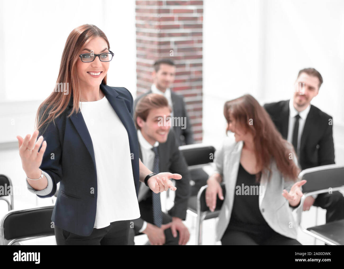 business woman while asking questions during seminar Stock Photo - Alamy