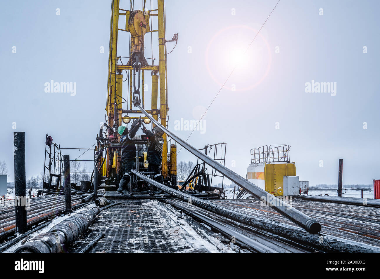 Workover rig working on a previously drilled well trying to restore ...