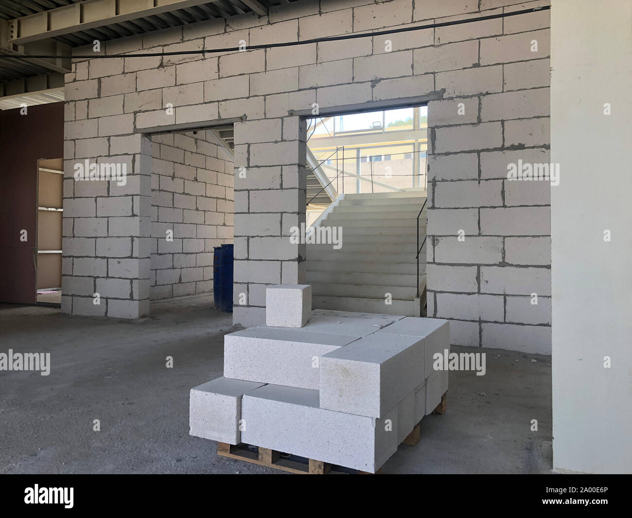 Piled cinder blocks on the floor of the prefabricated multi-storey ...