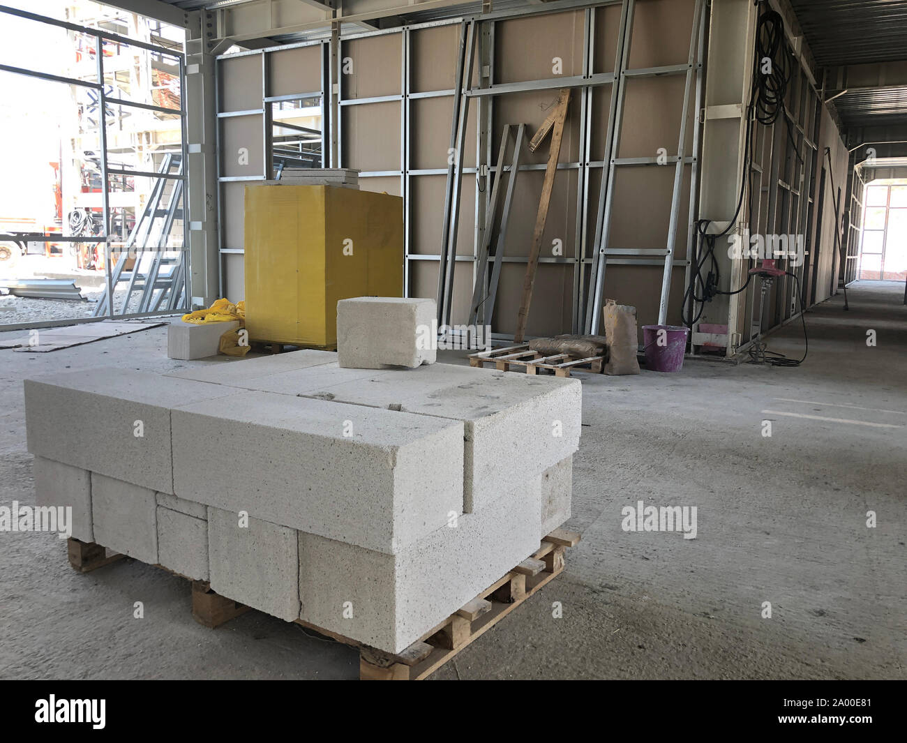 Piled cinder blocks on the floor of the prefabricated multi-storey ...