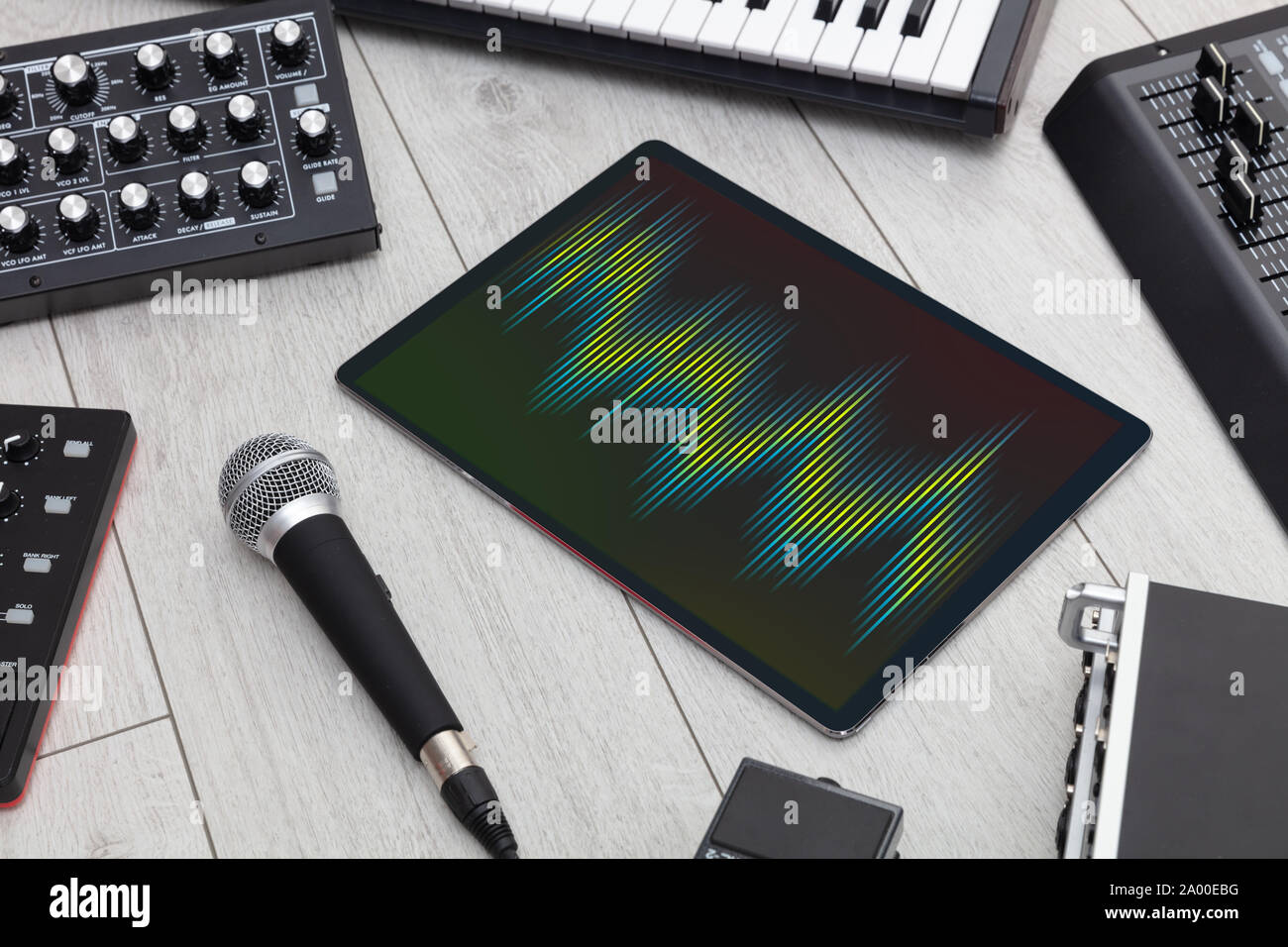Recording music with tablet and electronic music instruments Stock ...