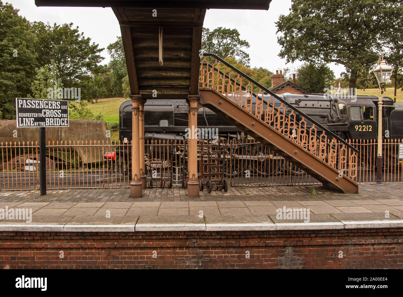 Underside of bridge crossing railway line between plaforms with steam ...