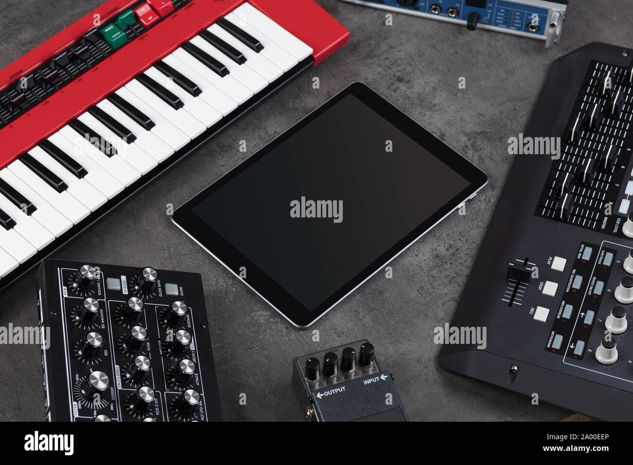 Empty tablet and electronic music instruments Stock Photo - Alamy