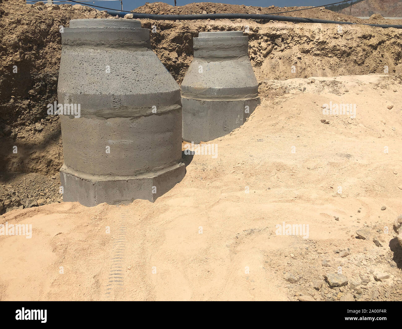 Storm water drainage reinforced concrete wells in the dug trench. Water ...