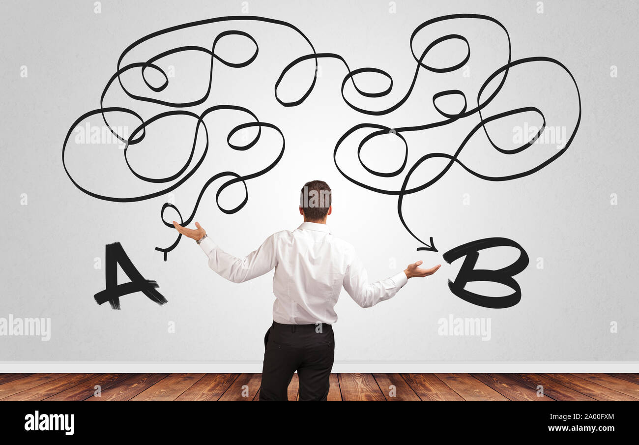 Businessman looking for connection between two things while standing in ...