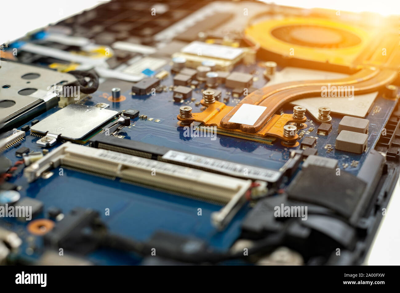 Technician repairing broken laptop notebook computer with screwdriver ...