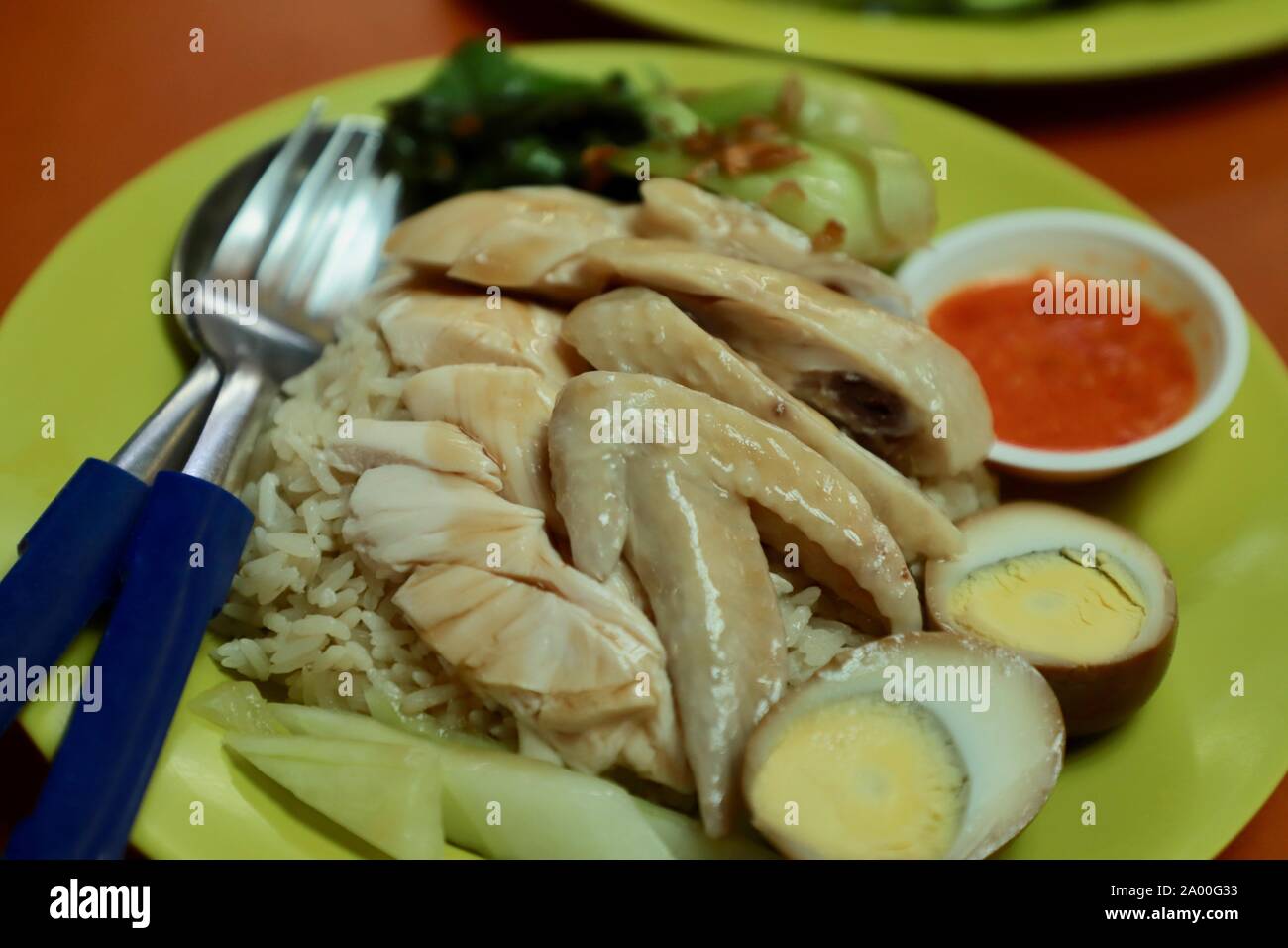 Hainanese Chicken Rice. Popular hawker dish of aromatic rice with ...