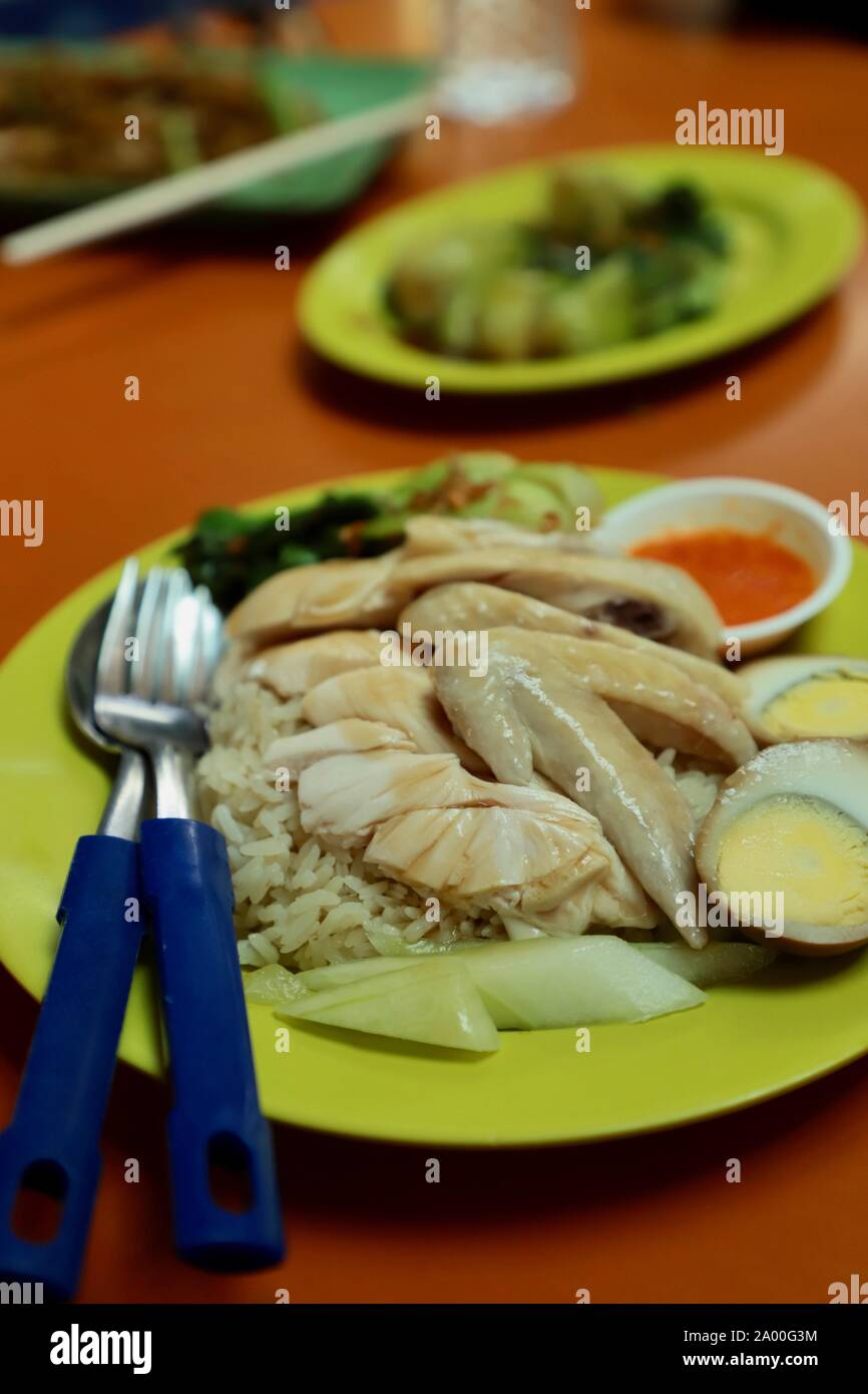 Hainanese Chicken Rice. Popular hawker dish of aromatic rice with ...