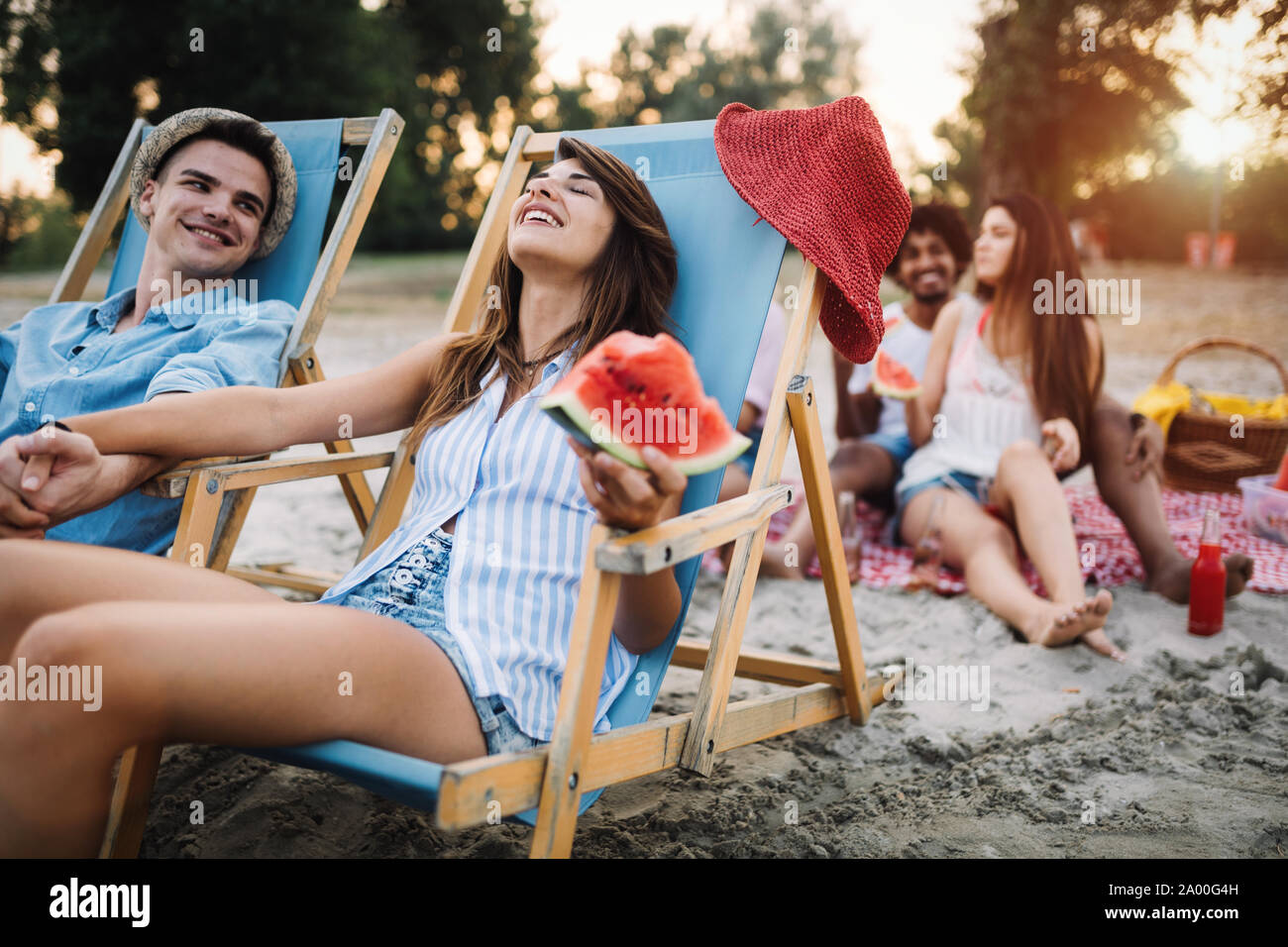 Group of young friends having fun on the beach in summer time Stock ...