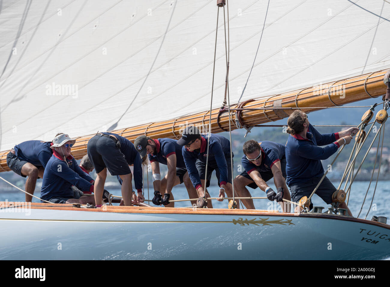 Crew members aboard on sailboat Tuiga, flagship of the Monaco Yacht ...