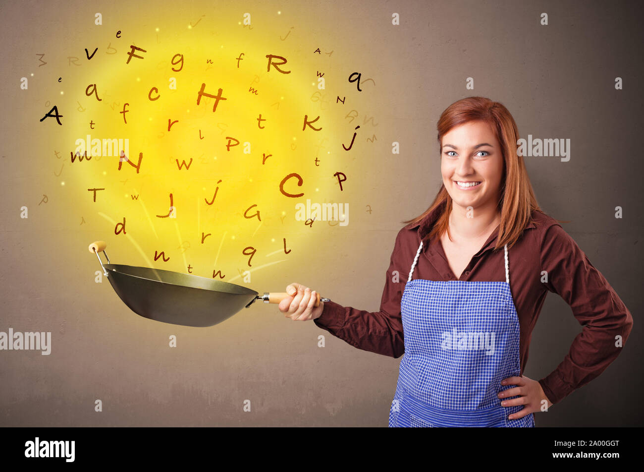 Young person cooking letters in wok Stock Photo - Alamy