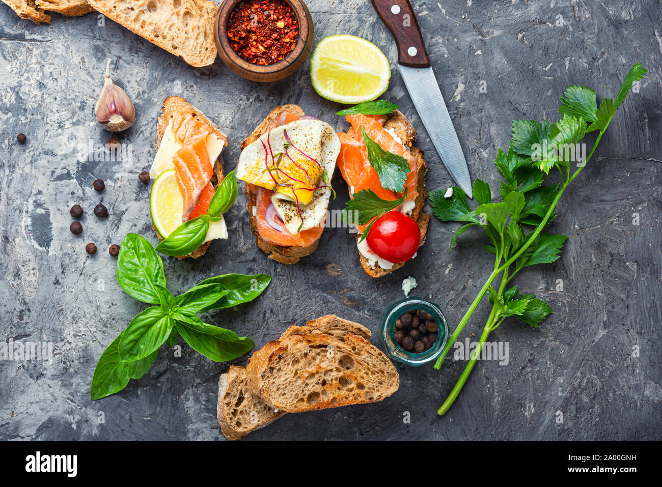 Traditional italian bruschetta.Open sandwich with salmon and vegetables ...