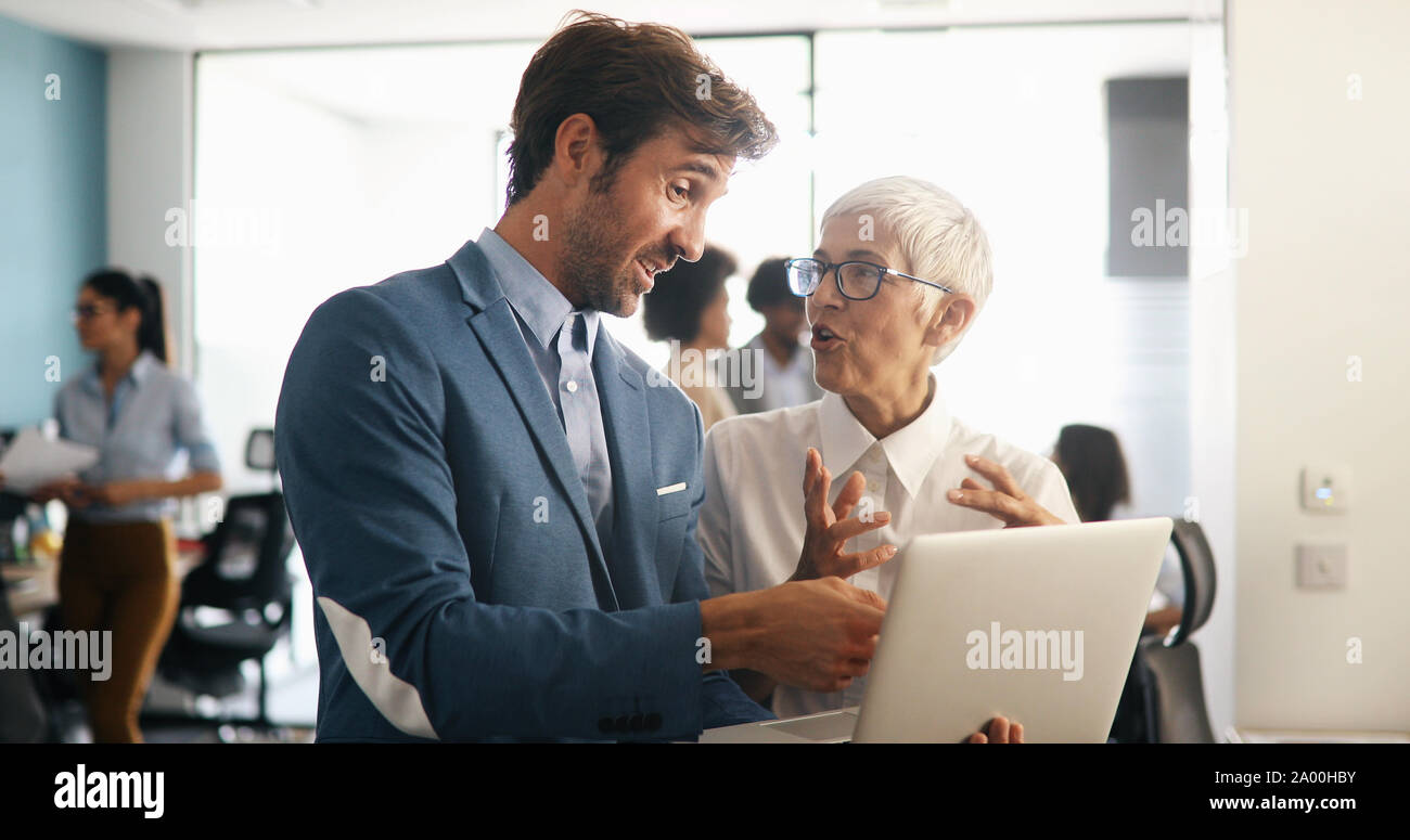 Colleagues developing software together hi-res stock photography and ...