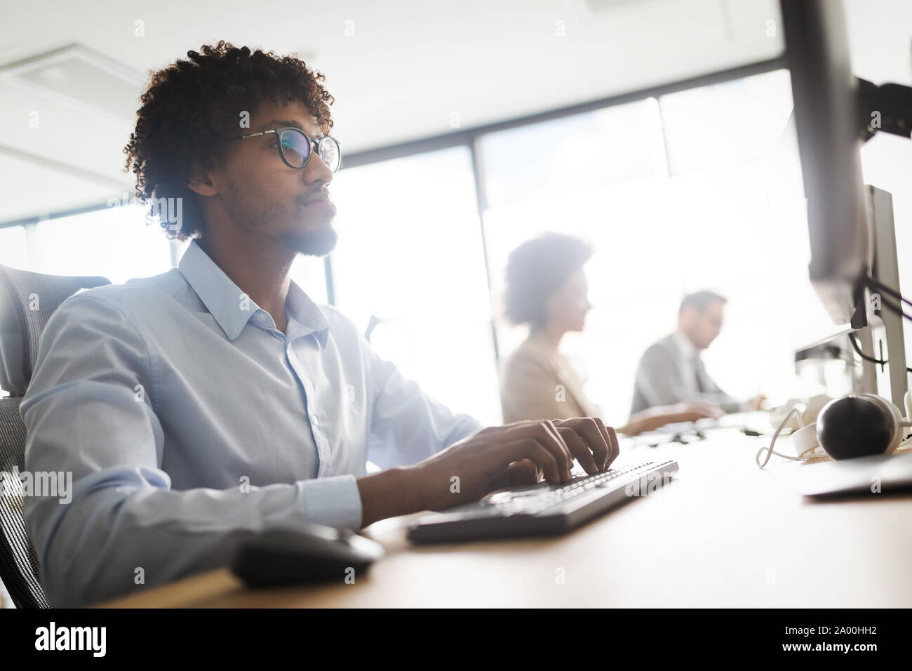 Successful group of business people at work in office Stock Photo - Alamy