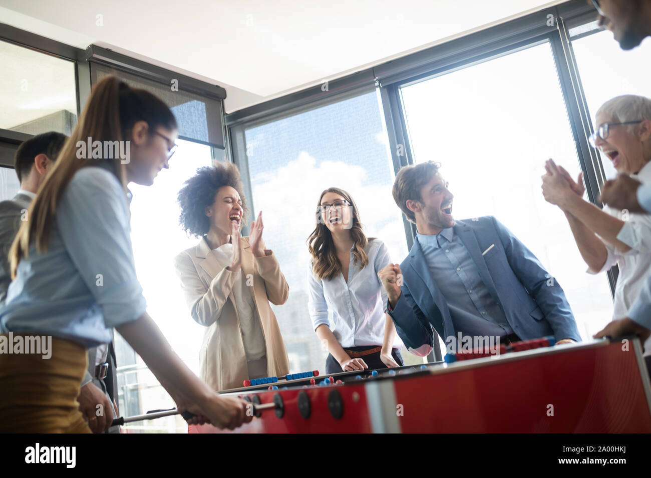Multicultural friends playing soccer hi-res stock photography and ...